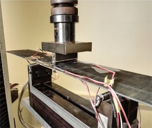 Experimental and numerical study of composite omega stringer–skin ...